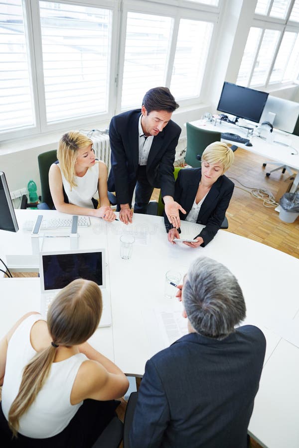 Team Talking in Business Meeting at Conference Table Stock Image ...