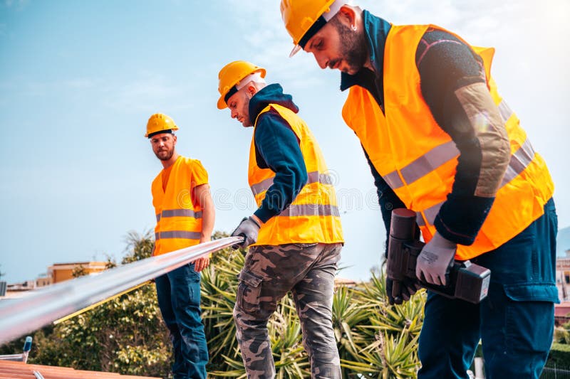Team of Technical Workers Work on the Roof of a House Stock Image ...