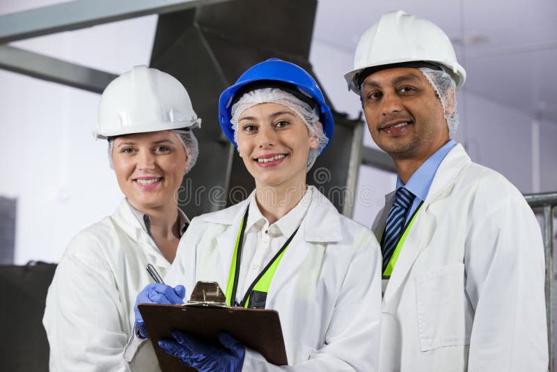 Team Of Technicians Standing In Meat Factory Stock Photo - Image of ...
