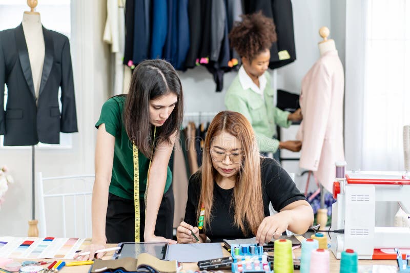 Team of Three Fashion Designers Preparation for Create New Clothes ...