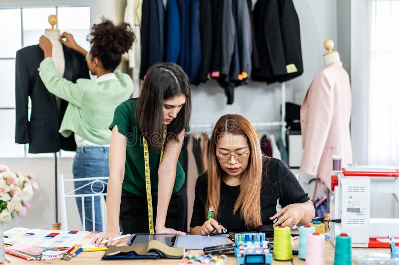 Team of Three Fashion Designers Preparation for Create New Clothes ...
