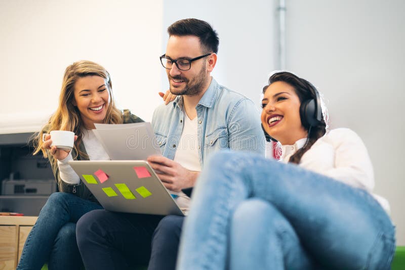 Team of Three Happily Working Together on Their Ideas Stock Image ...