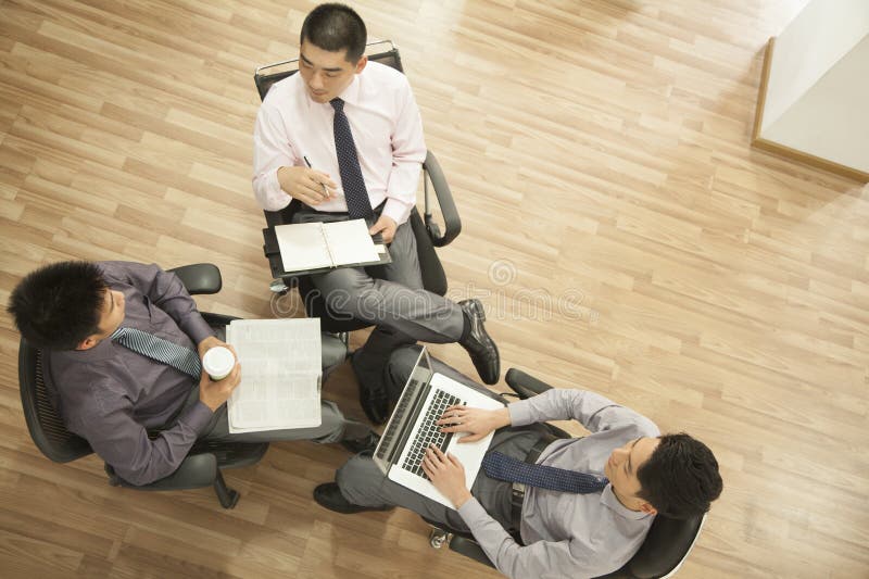 Team of Three People Working on the Project and Sitting in a Circle ...