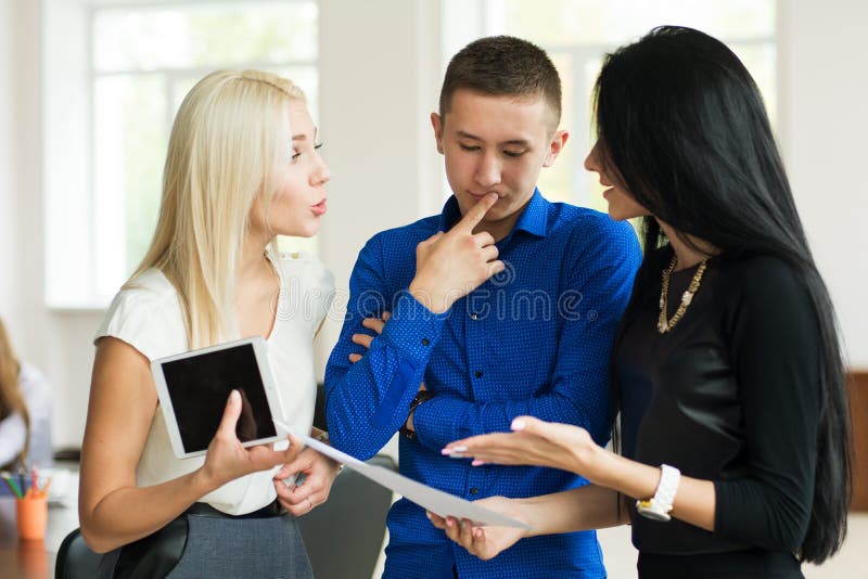 Team Three Successful Young Business People Discussing Off Stock Photos ...
