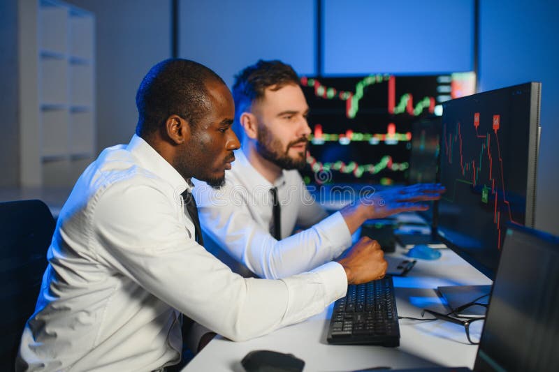 Team of Traders Working with Forex Trading Charts and Graphs on ...