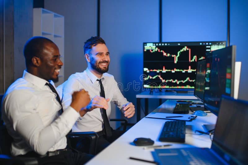 Team of Traders Working with Forex Trading Charts and Graphs on ...
