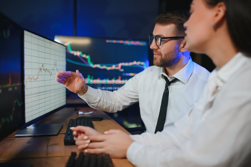 Team of Traders Working at Monitor Computer and Browsing Online in ...