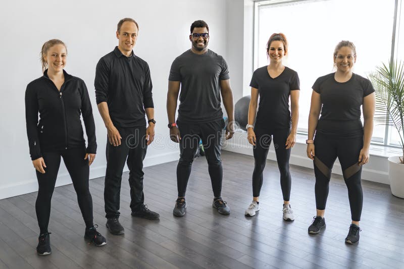 Team of Trainer Standing with a Smile in the Training Gym Stock Image ...