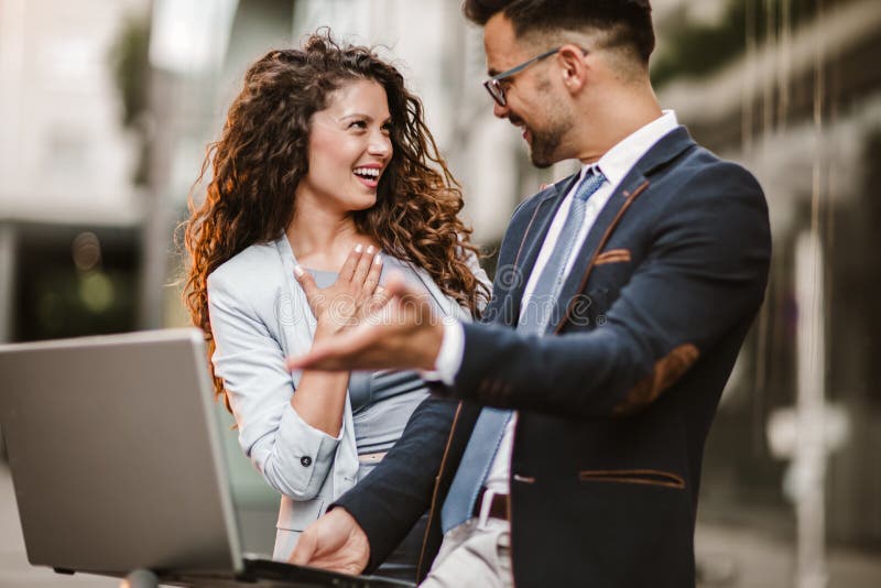 Two Business People Working Together Outdoors Using Laptop Stock Photo ...