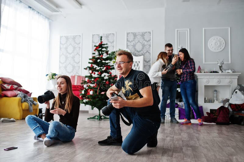 The Team of Two Photographers Shooting on Studio Behind Another Three ...