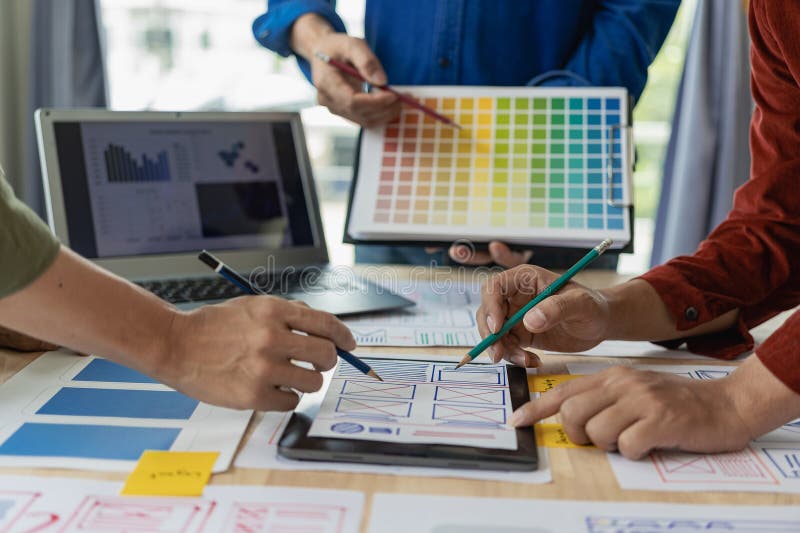 A Team of Web Designers with the Ux Ui System are Writing Programs and ...