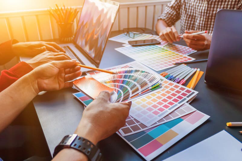 A Team of Web Designers are Working Together To Develop a Mobile ...