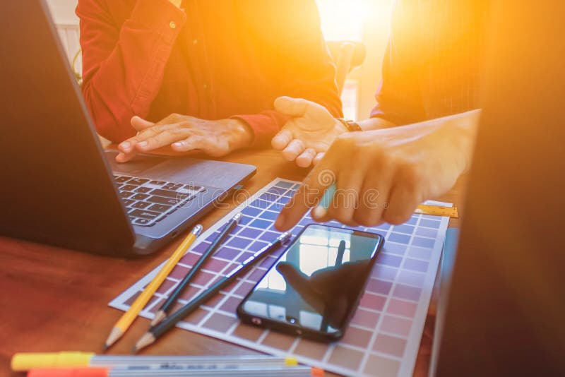 A Team of Web Designers are Working Together To Develop a Mobile ...