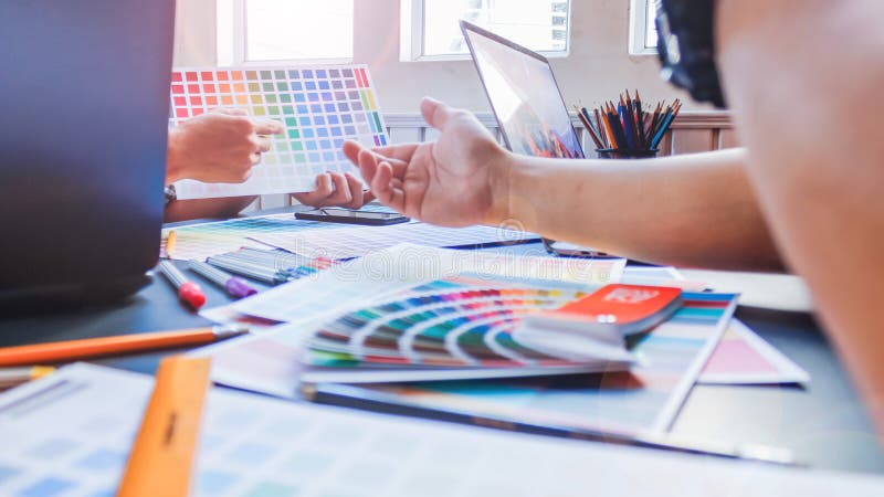 A Team of Web Designers are Working Together To Develop a Mobile ...