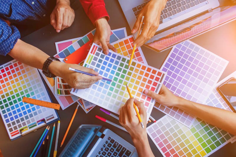 A Team of Web Designers are Working Together To Develop a Mobile ...