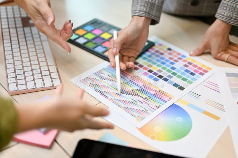 A Team of Web Developer or Graphic Designer Having a Meeting in the ...