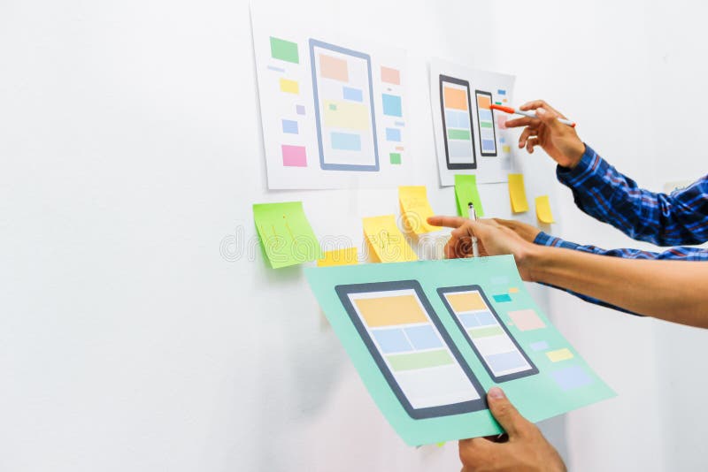 The Team of Website Designers with the Ux Ui System are Writing ...