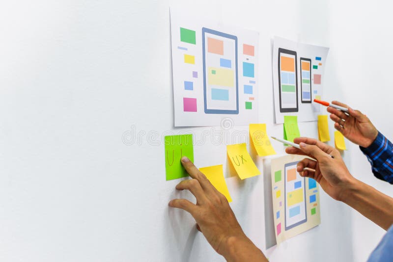 The Team of Website Designers with the Ux Ui System are Writing ...