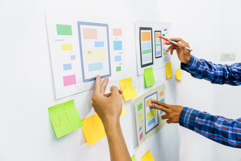 The Team of Website Designers with the Ux Ui System are Writing ...