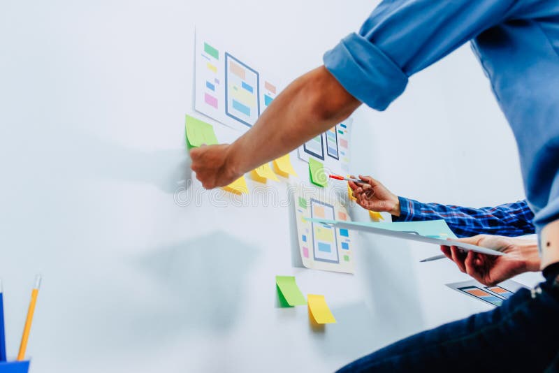 The Team of Website Designers with the Ux Ui System are Writing ...