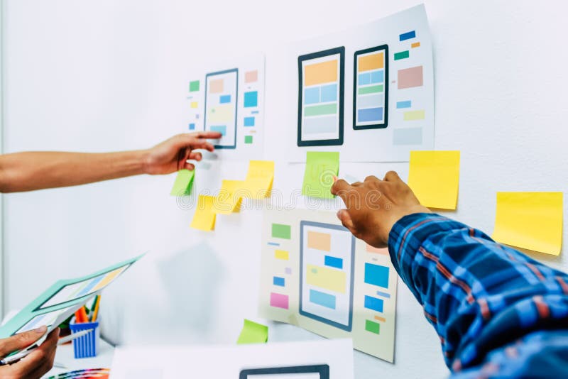 The Team of Website Designers with the Ux Ui System are Writing ...