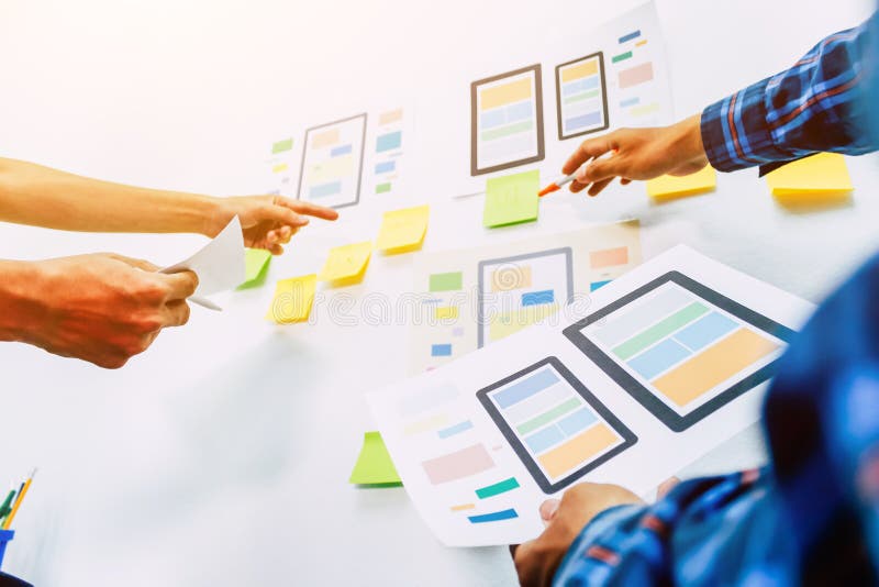 The Team of Website Designers with the Ux Ui System are Writing ...