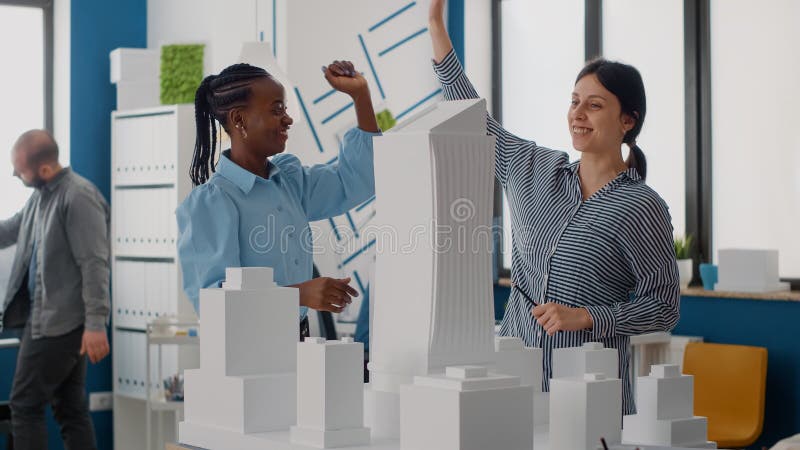 Team of Women Giving Highfive after Architecture Work Progress with ...