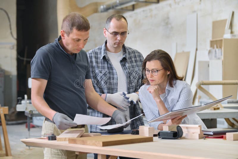 Team of Woodworking Workshop Workers are Discussing. Group of People ...