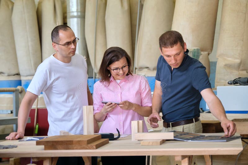 Team of Woodworking Workshop Workers are Discussing Stock Photo - Image ...