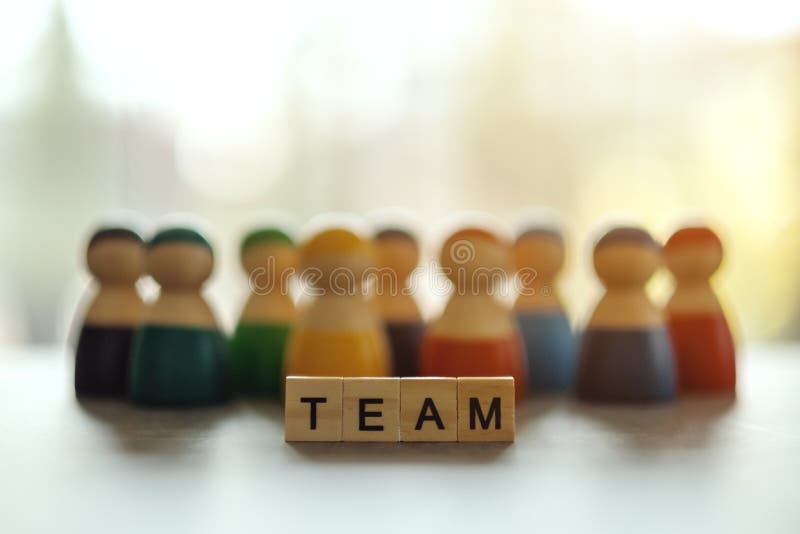 TEAM Word on Wooden Blocks with a Group of People Stock Image - Image ...