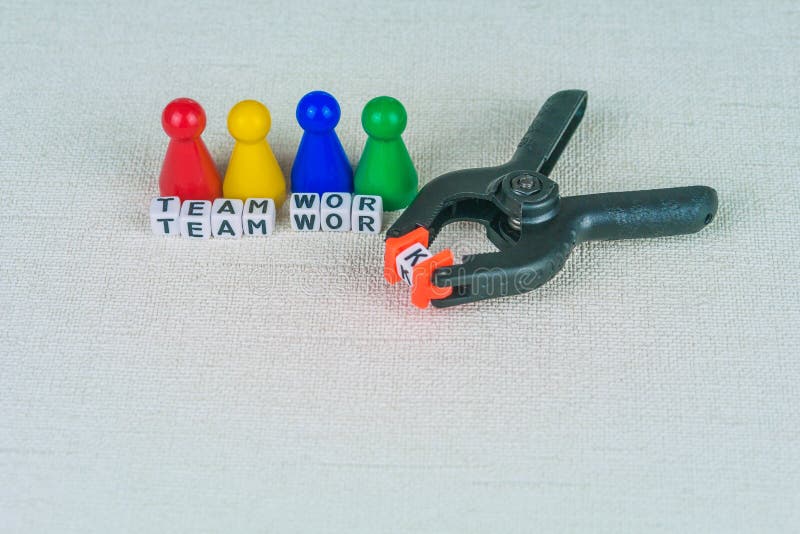 Team Work Concept - Figures in the Line and an Clamp Tool As Symbol for ...