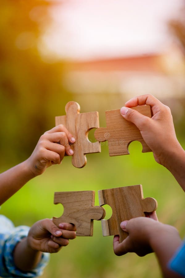 Hands and Jig Saw Unite with Power is a Good Team of Successful People ...