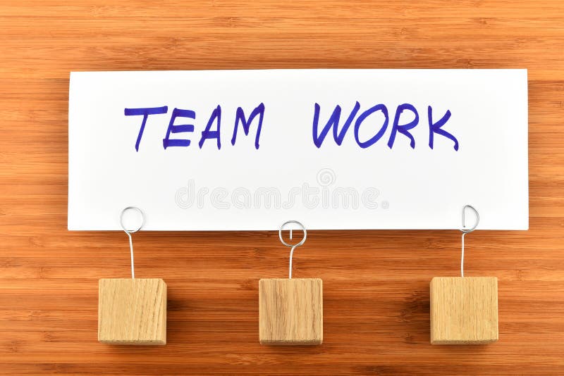 Team Work, One Paper Note with Holders on Wooden Background Stock Photo ...