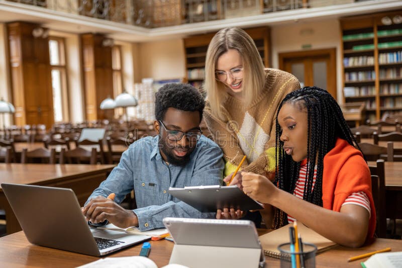 Team of Students Looking Involved and Interested while Working in the ...