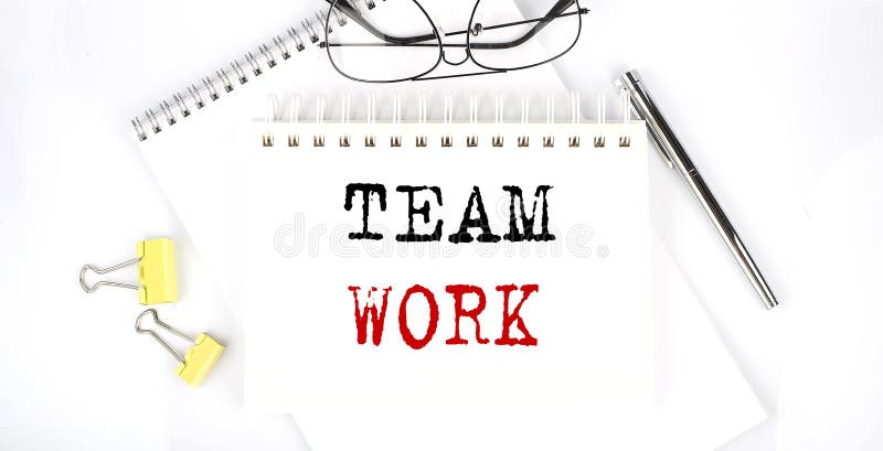 TEAM WORK Text on the Notebook with Pen,clips and Glasses Stock Image ...