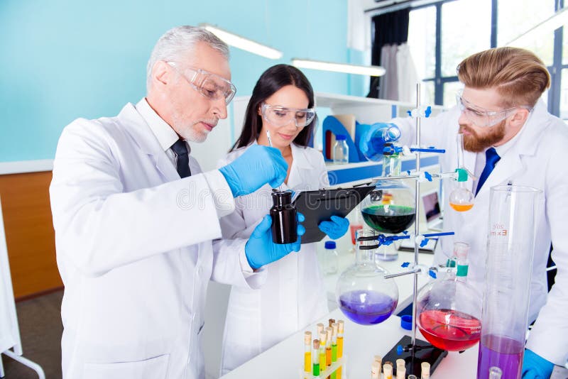 Team Work. Three Scientists are Working Together for New Experi Stock ...