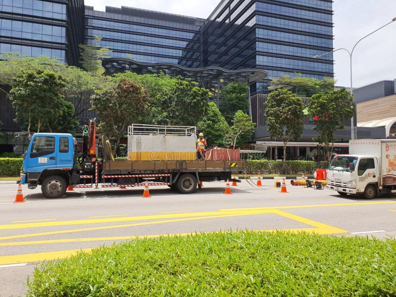 Road work in Singapore editorial photography. Image of worker - 324970597