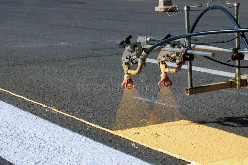 A Team of Workers Drawing a Pedestrian Crossing in Early Spring Using ...