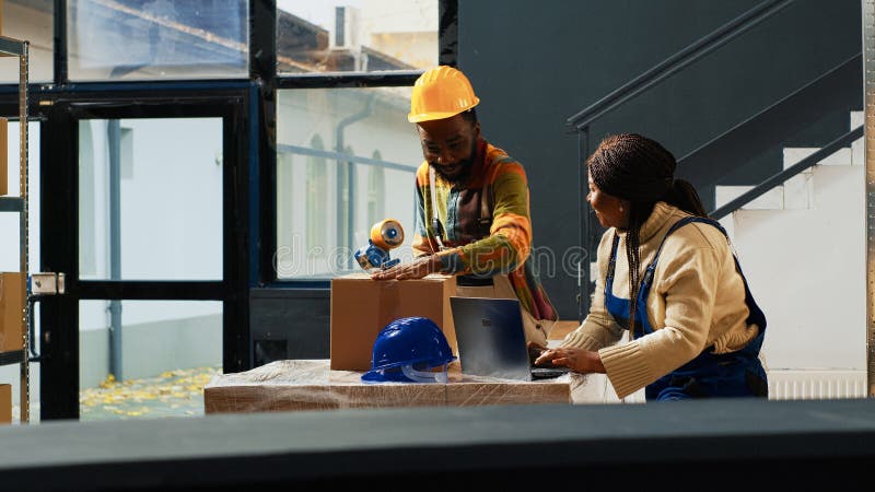 Team of Workers Using Racks and Shelves To Stack Boxes Stock Photo ...