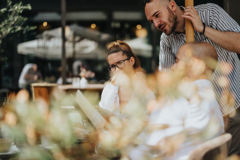 Team Working and Brainstorming Together in a Relaxed Outdoor Setting ...