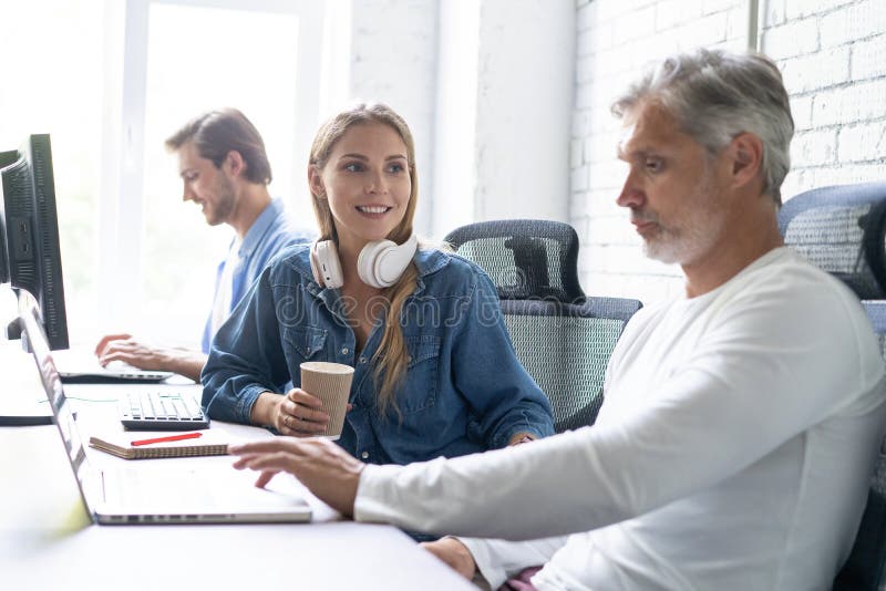 Team Working at Desks in Busy Office. Stock Photo - Image of indoors ...