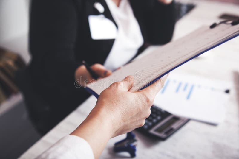 Team working in document stock photo. Image of table - 140460372