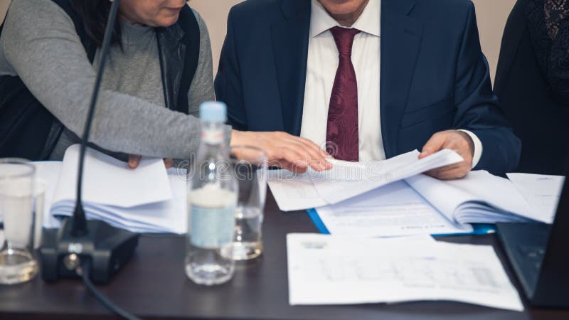 Team working in documents stock image. Image of meeting - 222222923