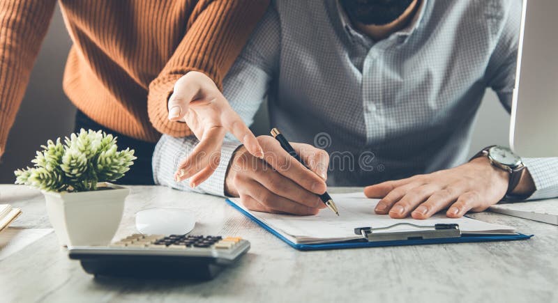 Team Working Hand Calculator with Document on Desk Stock Image - Image ...