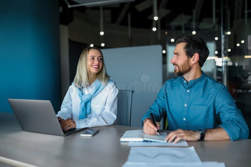 Team Working on Project Materials and Looking Excited Stock Photo ...
