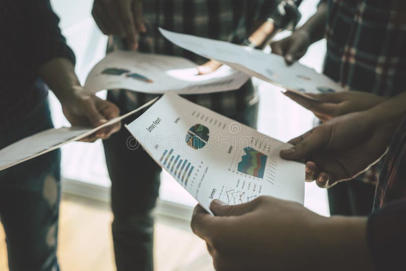 Team Working Together Analyzing Business Data on Report Stock Image ...