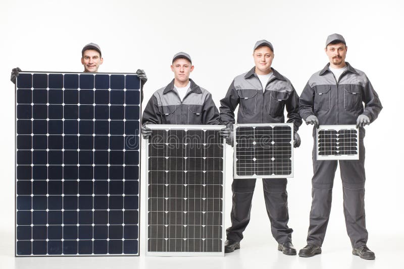 Team Working with a Variety of Solar Panels Stock Photo - Image of ...