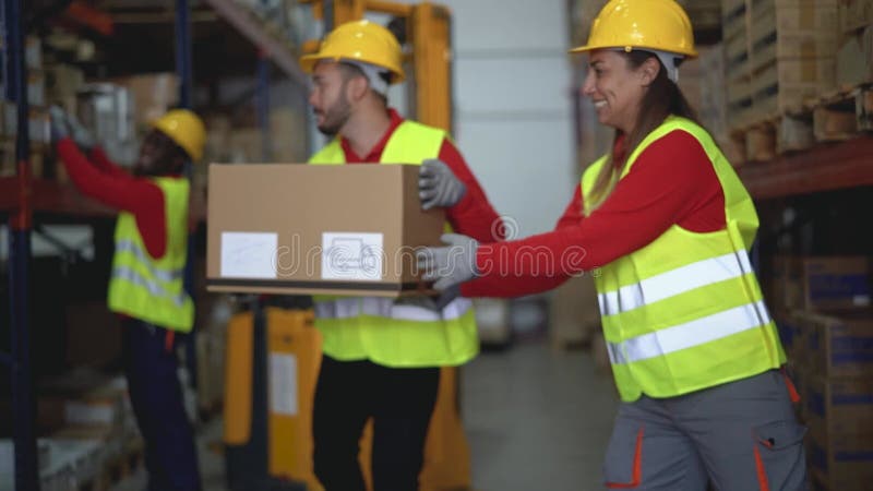 Team Working in Warehouse Doing Inventory Using Digital Tablet and ...