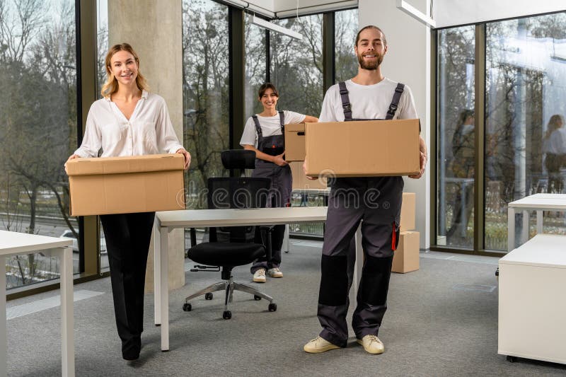 Team of Young Colleagues Working in a Packaging Office Stock Image ...