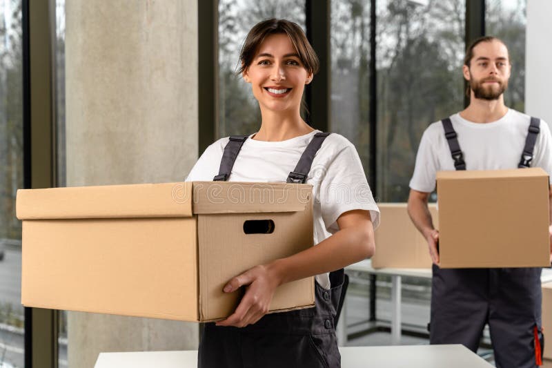 Team of Young Colleagues Working in a Packaging Office Stock Image ...